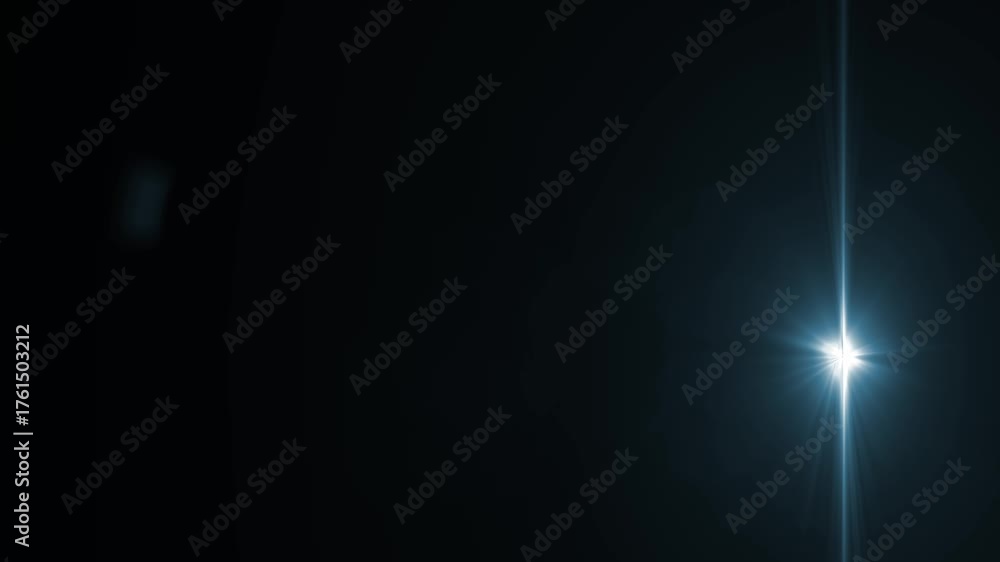 Intense blue anamorphic lens flare with vertical streak appears on ...