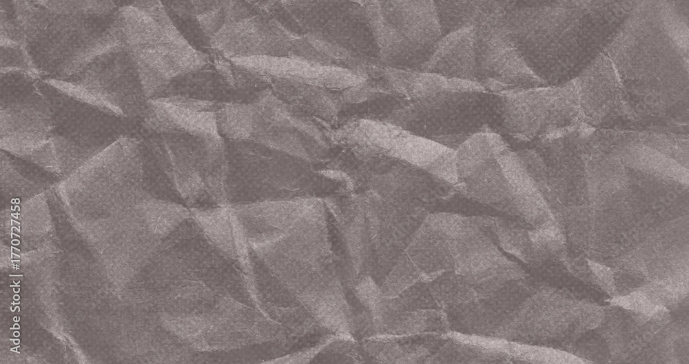 Subtle crumpled paper texture in mocha brown tone seamlessly looping ...