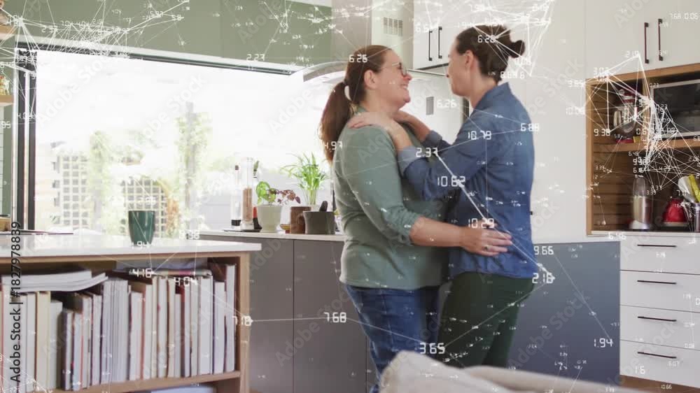 Two women stepping closer and hugging in kitchen, animated network ...