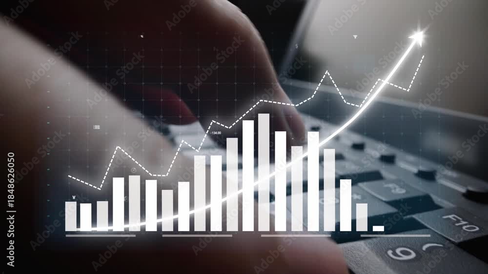 A close-up view of hands on a keyboard illustrates data analytics and ...