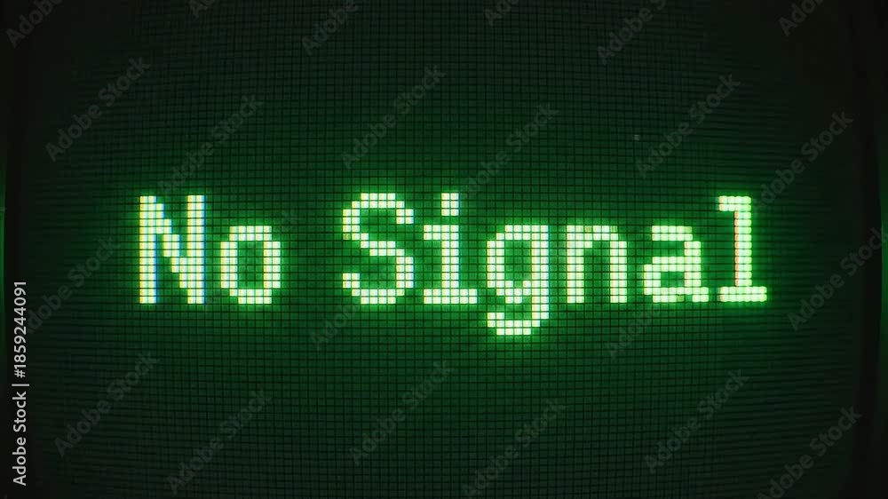 Glitching tv screen showing no signal message in green font with heavy ...