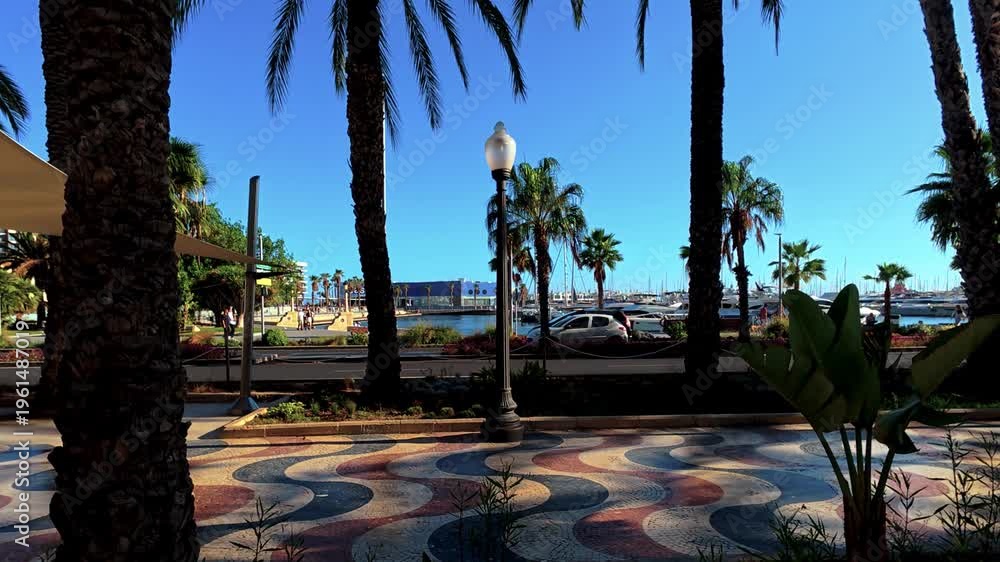 Mediterranean promenade with mosaic pavement and palm trees, horizontal ...