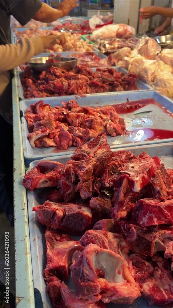 Dynamic marketplace panorama: abundant fresh butchered meat, prime cuts ...